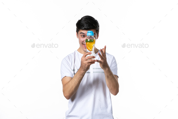 front view young man with bottle of lemonade on white background drink ...