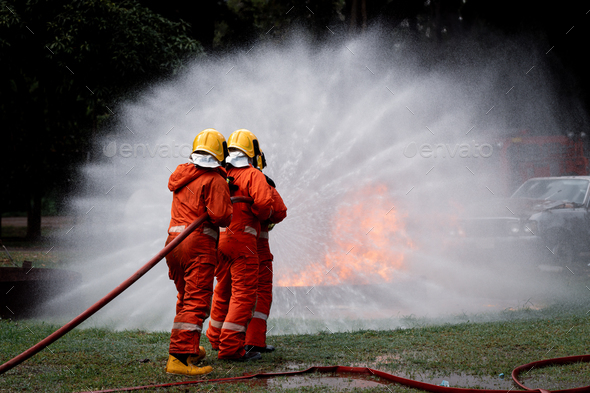Firefighters safety using twirl water fog type fire extinguisher to ...