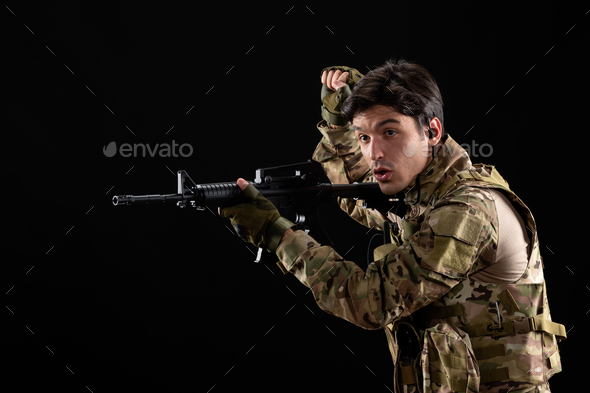 front view young soldier in uniform with rifle on black background tank ...