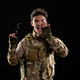front view of screaming military serviceman in uniform with gun black ...