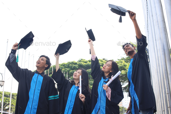 Graduation day celebration with friends Stock Photo by Garakta-Studio