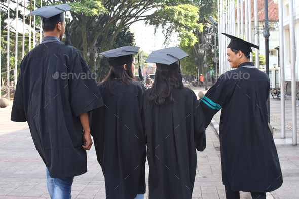 Graduation day celebration with friends Stock Photo by Garakta-Studio