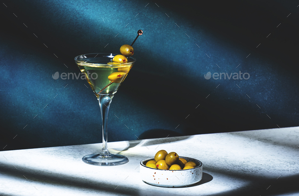 Vodka martini with olives, alcoholic cocktail drink with vodka and ...