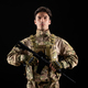 front view of military serviceman in uniform with rifle on black ...