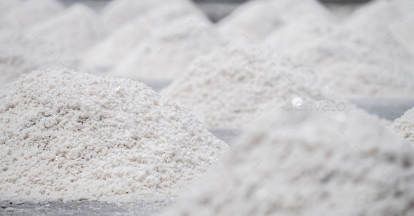 Sea salt farm. Pile of brine salt. Raw material of salt industrial ...