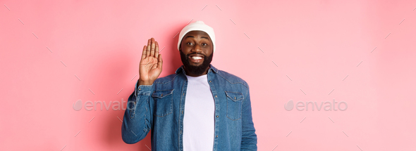 Friendly smiling Black man saying hello, waving hand, greeting you ...