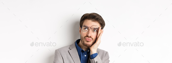 Close-up of shocked tired office worker takes-off glasses and stare at ...