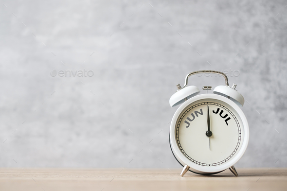 Hello July Changed from June month with vintage alarm clock Stock Photo ...