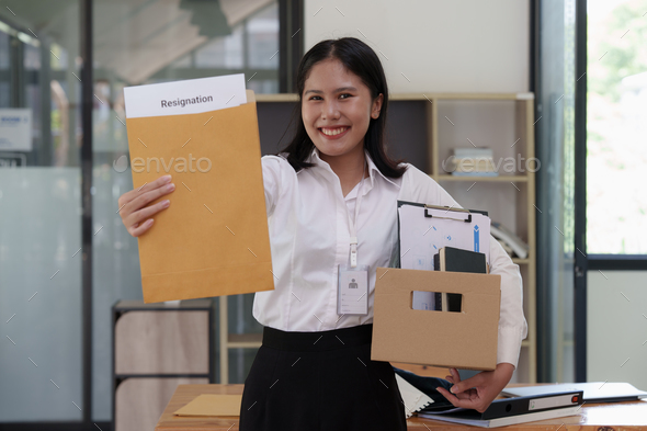 Resignation concept. Employee holding box of belongings in an office ...