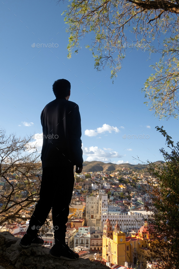 A man enjoying the vibrant cityscape of Guanajuato, Mexico, surrounded ...