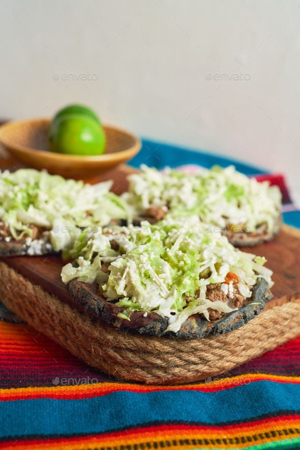 Traditional mexican food: picadillo sopes Stock Photo by FabianMontano