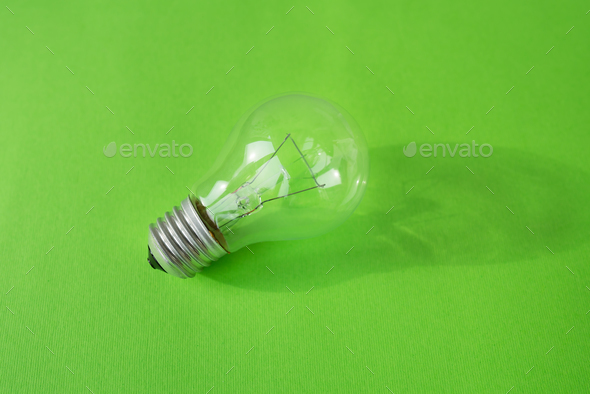 Modern lamp on a green background, light bulb shadow. Stock Photo by ...