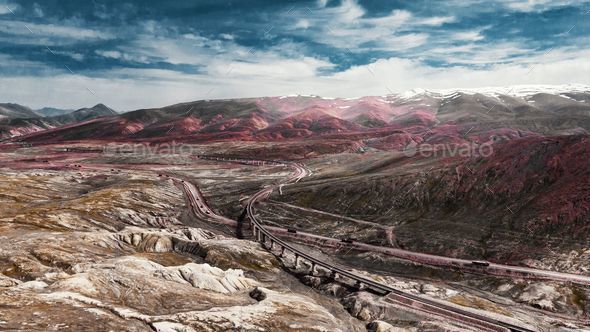 Scenic aerial view of the Gobi desert, surrounded by lush green forests ...