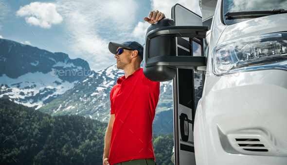 Caucasian Man on a Camper Van RV Road Trip. Stock Photo by duallogic