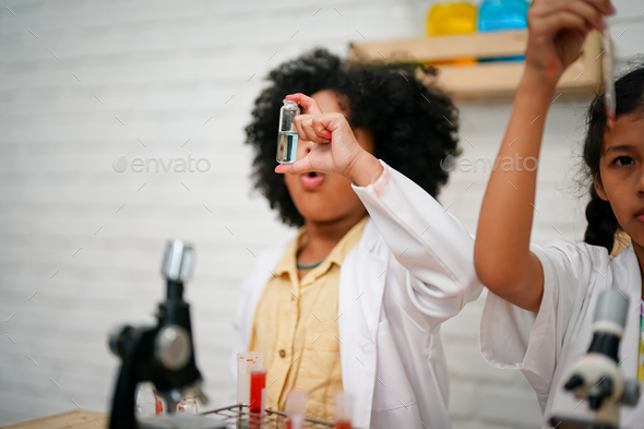 Pupils experimenting in science class Stock Photo by FoToArtist_1 ...