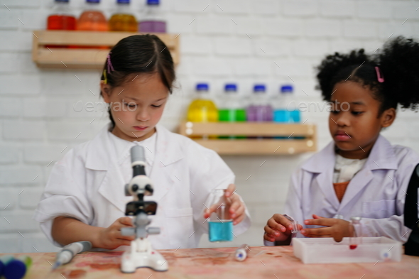 Pupils experimenting in science class Stock Photo by FoToArtist_1 ...