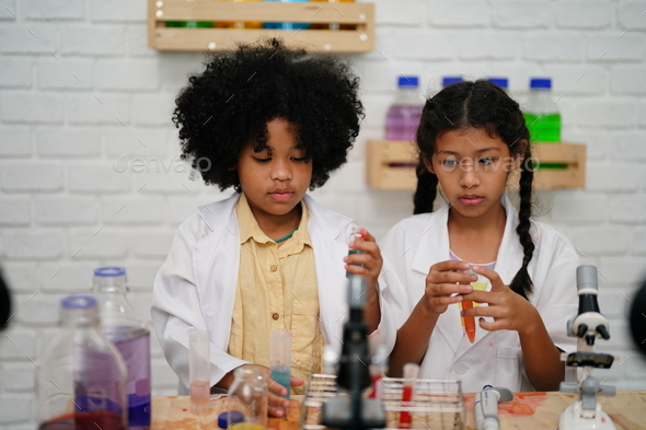 Pupils experimenting in science class Stock Photo by FoToArtist_1 ...