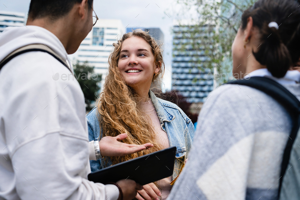 Group of university students talking in urban campus in the city ...