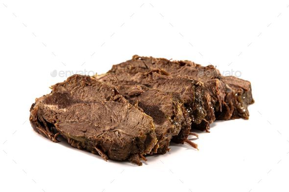 Close-up image of four pieces of cooked beef on a white background ...