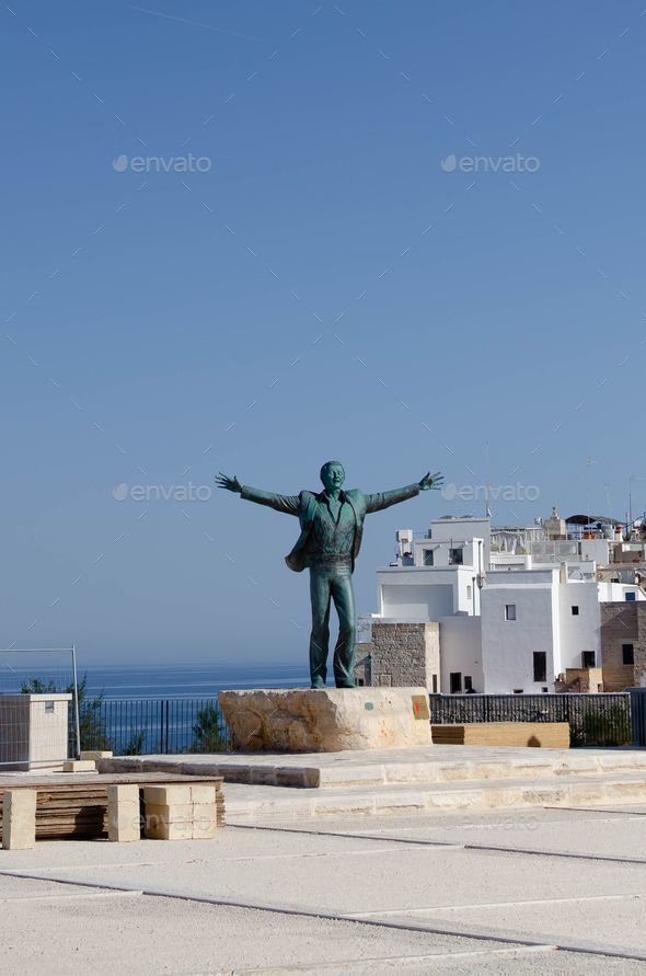 Historic Statue of Italian singer Domenico Modugno on the shore of Mare ...