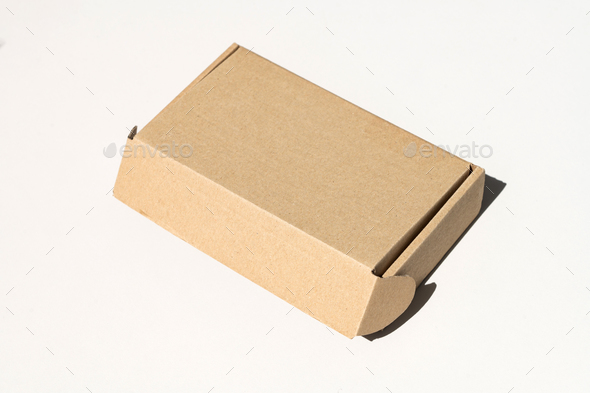 Rectangular closed box made of corrugated cardboard on a white ...