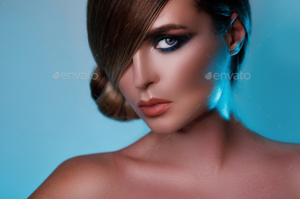 Model in stylish image with sleek hair covering one eye and beautiful ...