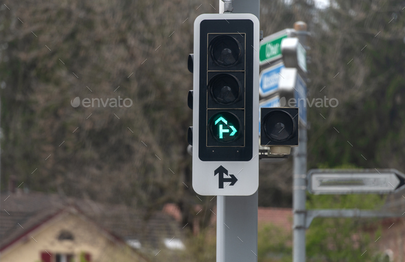 Green direction traffic light on blurred city background Stock Photo by ...