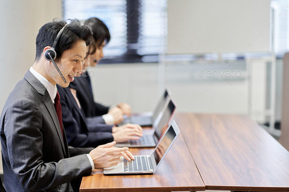 Asian business person responding at the customer center Stock Photo by ...