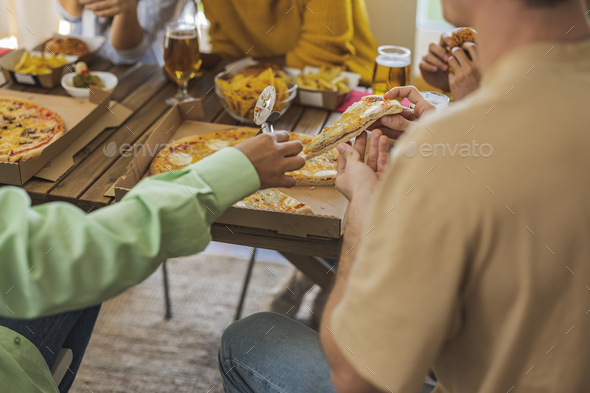 detail of group of people eating pizza Stock Photo by josecarloscerdeno