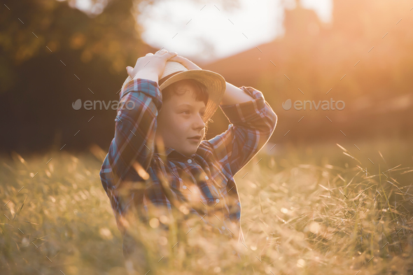 Cute little girl having fun in a dandelion field Stock Photo by erika8213