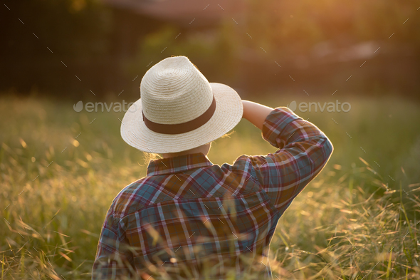 Cute little girl having fun in a dandelion field Stock Photo by erika8213