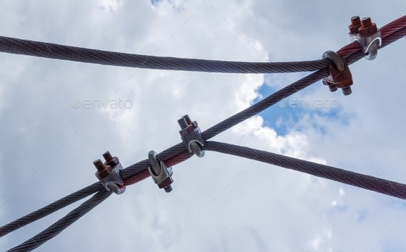 Cable with fastening with bolts and nuts of, outdoors Stock Photo by ...