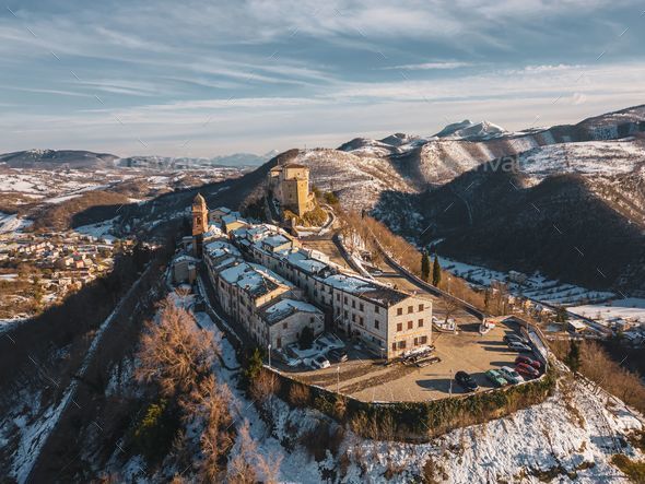 Aerial view of the medieval village of Pergola with a snowy grand ...