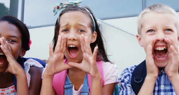 Group of kids shouting and screaming at school staircase, Stock Footage