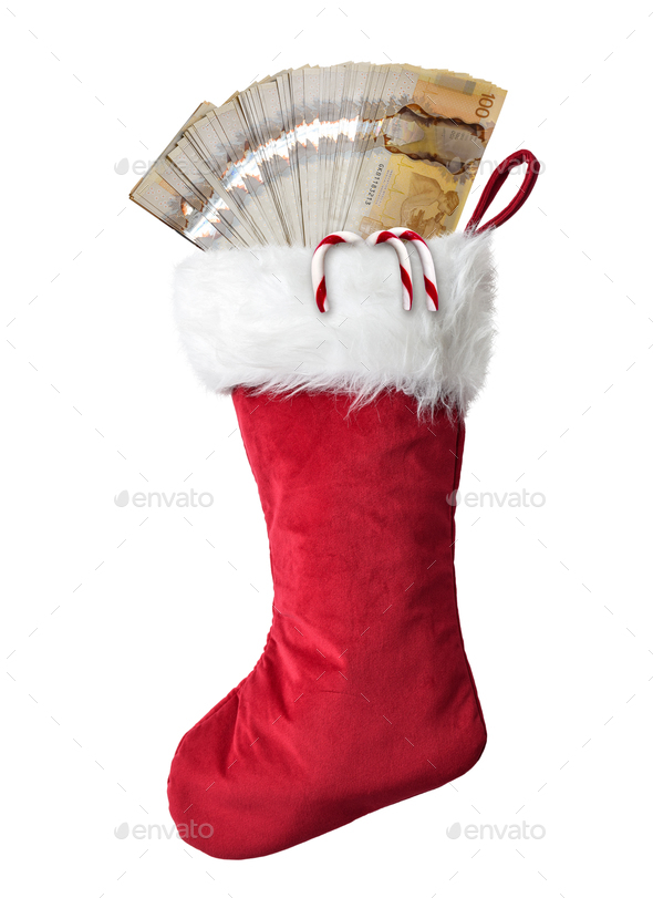 Red and white Christmas stocking filled with canadian cash money ...