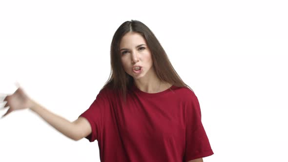 Annoyed and Angry Brunette Woman in Red Tshirt Scolding Someone Looking ...