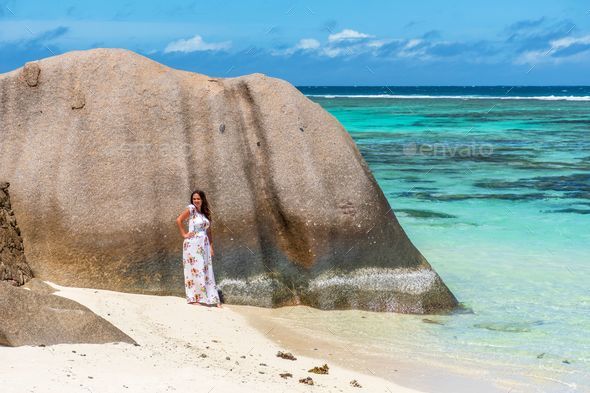 Full body portrait of beautiful girl wearing sun dress standing on ...