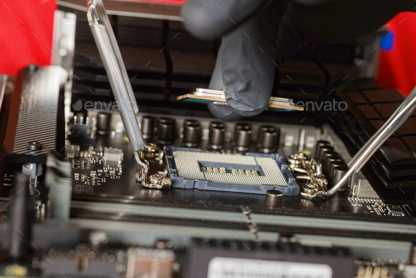 Assembling desktop computer with plug in CPU to motherboard socket ...