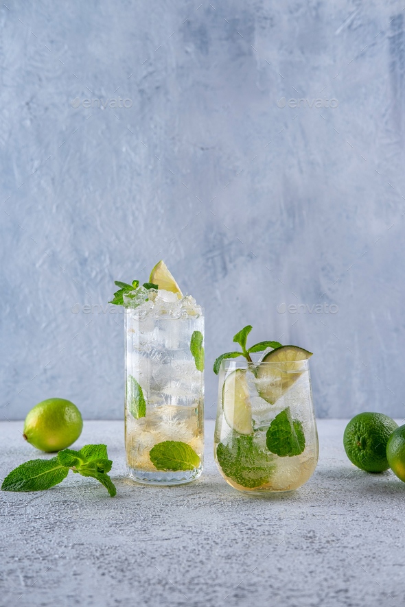 Cocktail Mojito. Cocktail with rum, mint, lime and ice in a glass on a ...