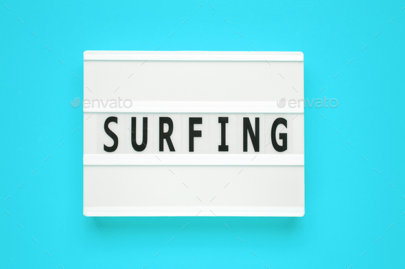The word surfing on lightbox isolated blue background. Water sport ...