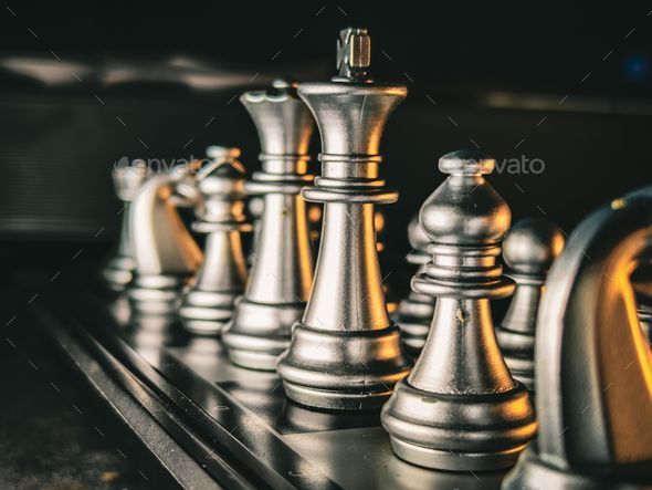 Classic chess board with a full set of silver pieces Stock Photo by ...