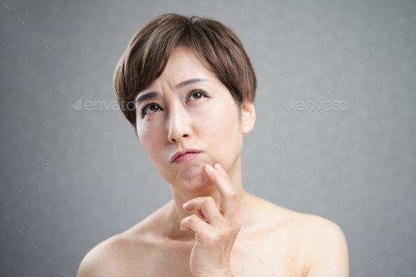 Middle-aged Japanese woman suffering from rough skin Stock Photo by ...
