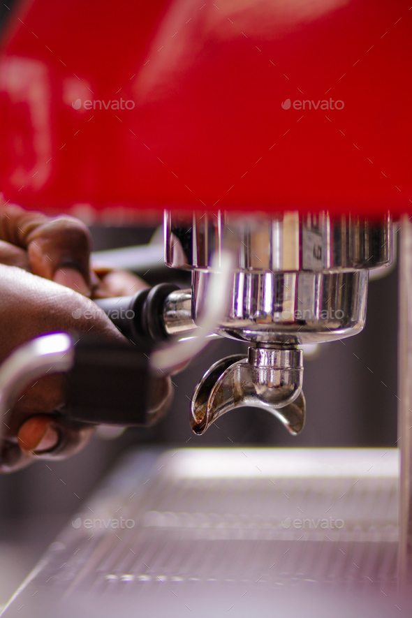 Hands handling the Coffee Maker machine Stock Photo by antonytrivet