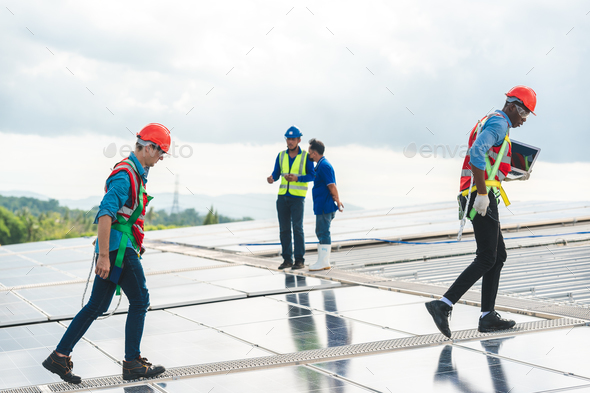 Professional engineer team installing solar photovoltaic panel system ...