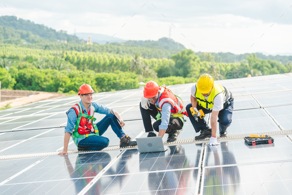 Professional engineer team installing solar photovoltaic panel system ...