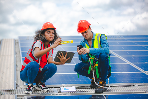 Professional engineer team installing solar photovoltaic panel system ...
