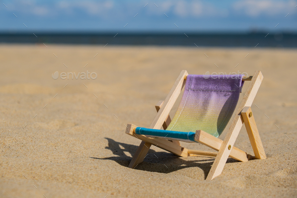 Sunny holidays on the beach sand beach accessories. Sun lounger stand ...