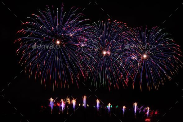 Night-time scene featuring a stunning display of colorful fireworks ...