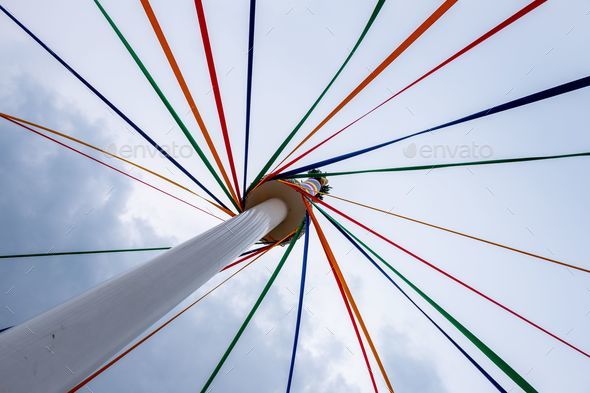 Low angle shot of a classic English Maypole during a dancing festival ...