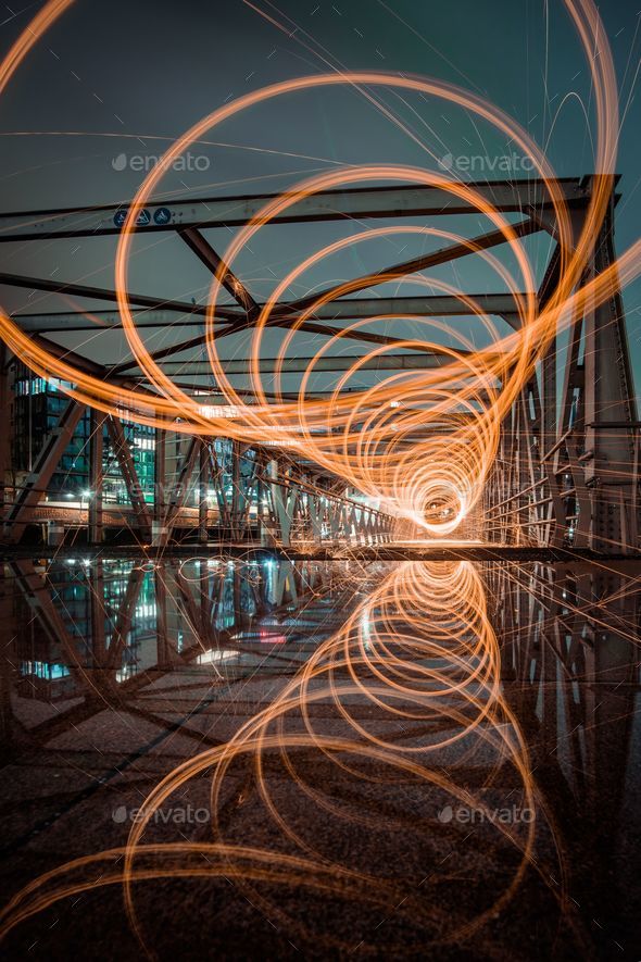 Motion blur effect of glowing light trails on a night downtown ...